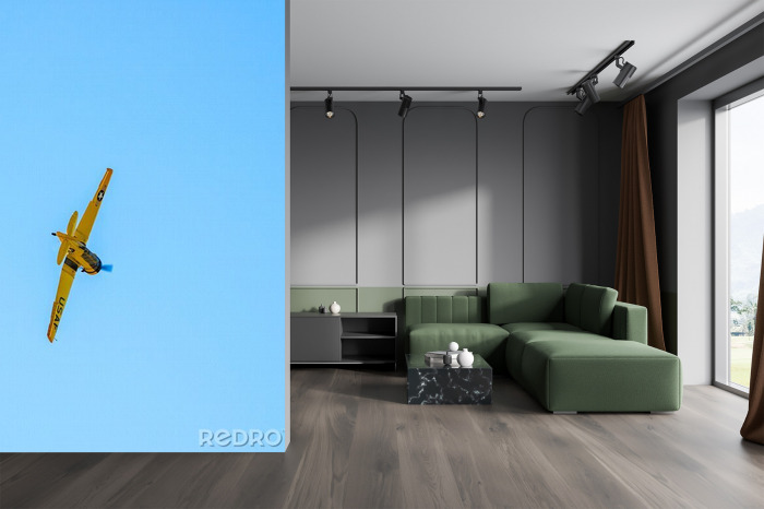 Fototapeta An AT6 Texan goes into roll over the airfield during an ...